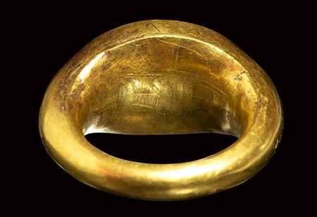A large banded agate intaglio set in a Sabean gold ring. Emblema with ...