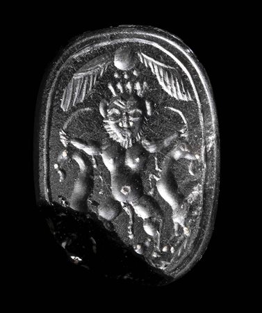 A LARGE PHOENICIAN BLACK JASPER ENGRAVED SCARAB. BES WITH ANIMALS ...